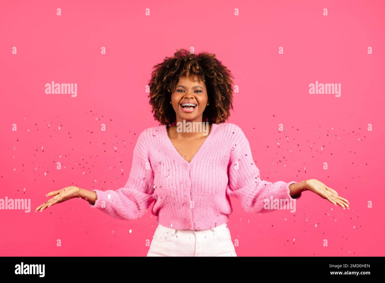 Cheerful millennial african american lady in casual laughing with open ...