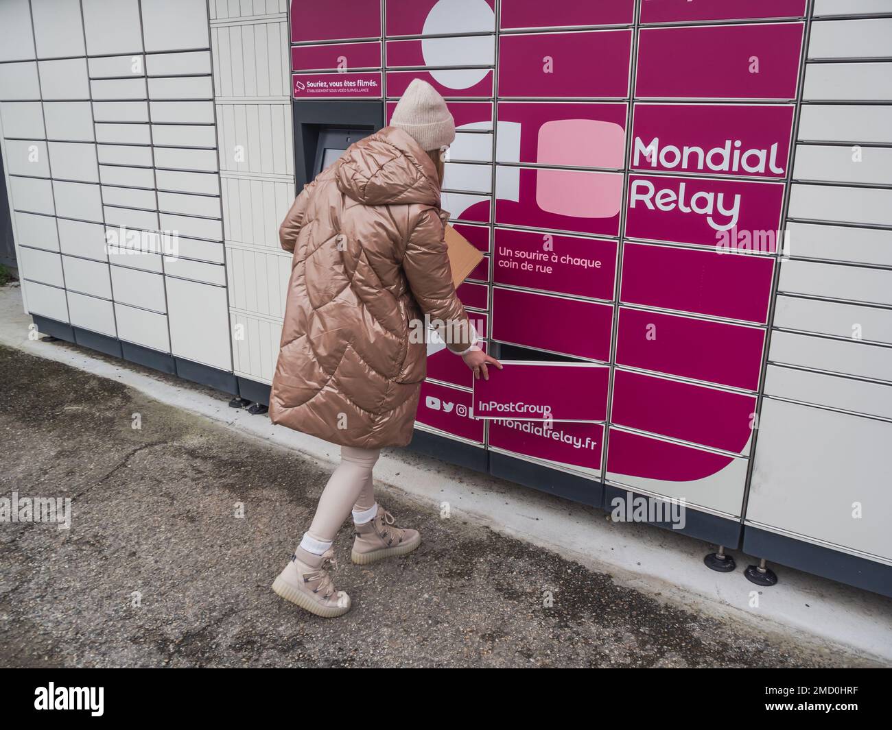 Loriol sur Drome, France - January 14, 2023: Picking up a parcel from a ...