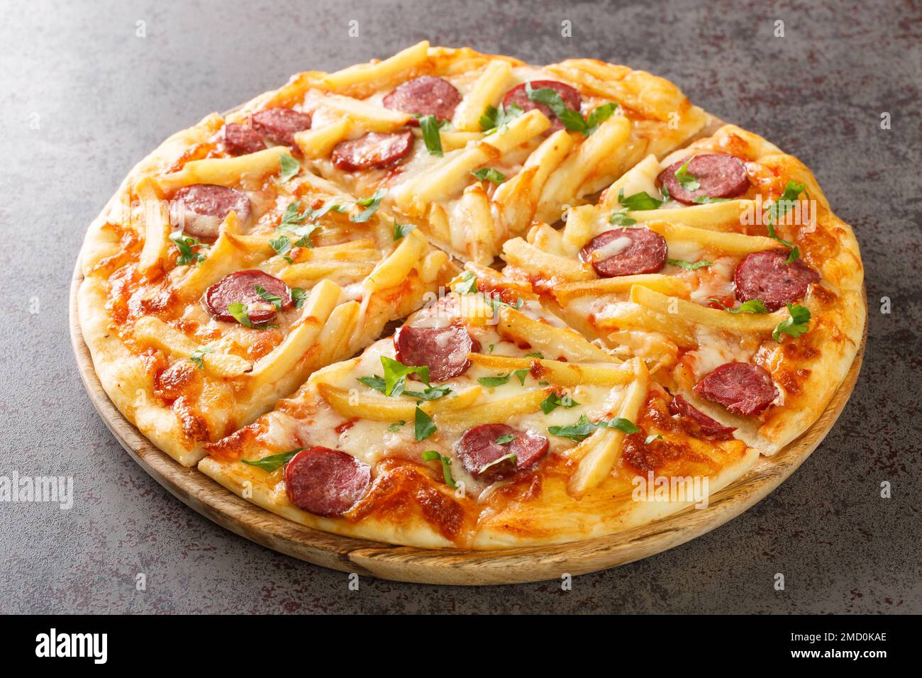 Tasty Americana Pizza with french fries, wurstel, cheese, tomato sauce ...