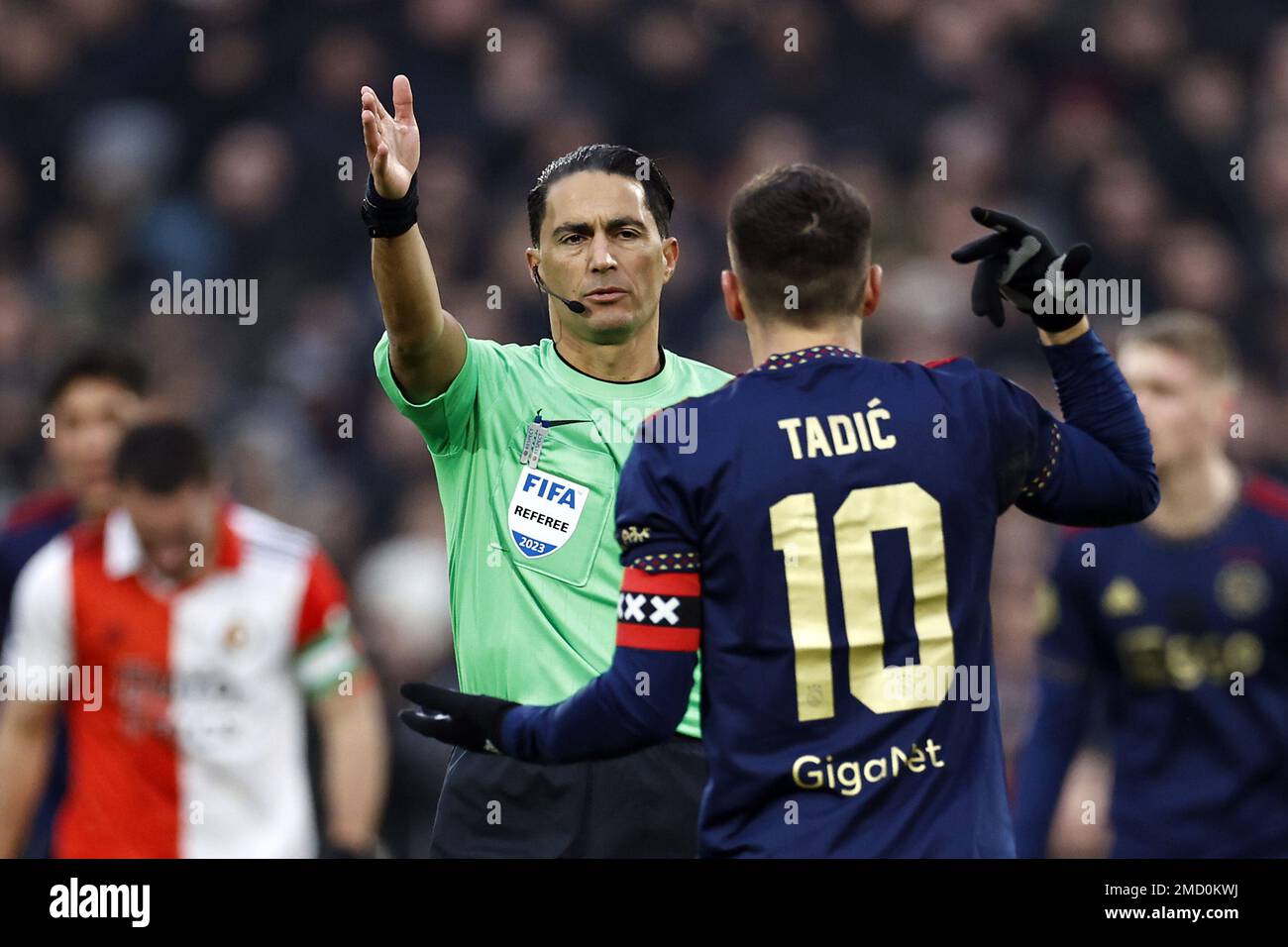 ROTTERDAM - (LR) referee Serdar Gozubuyuk, Dusan Tadic of Ajax during ...