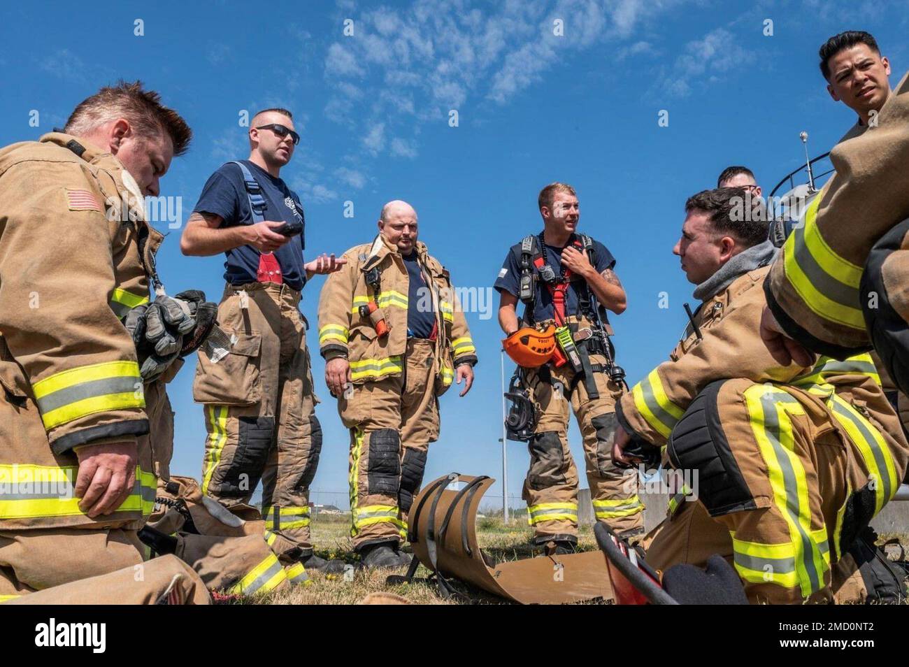 Firefighters with the 914th Fire Emergency Services debrief after ...