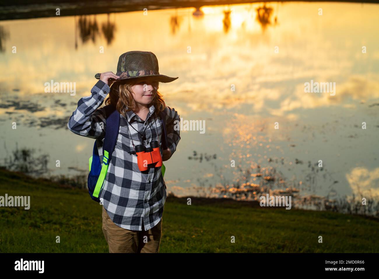 Happy child playing with binoculars. Explore and adventure. Child boy ...