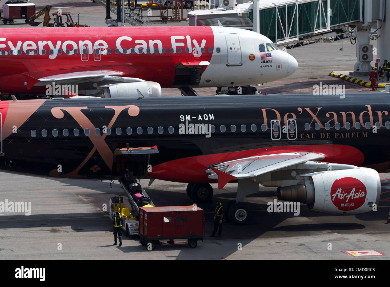 Ground staff unload from Air Asia planes Airbus A320 which parked at ...