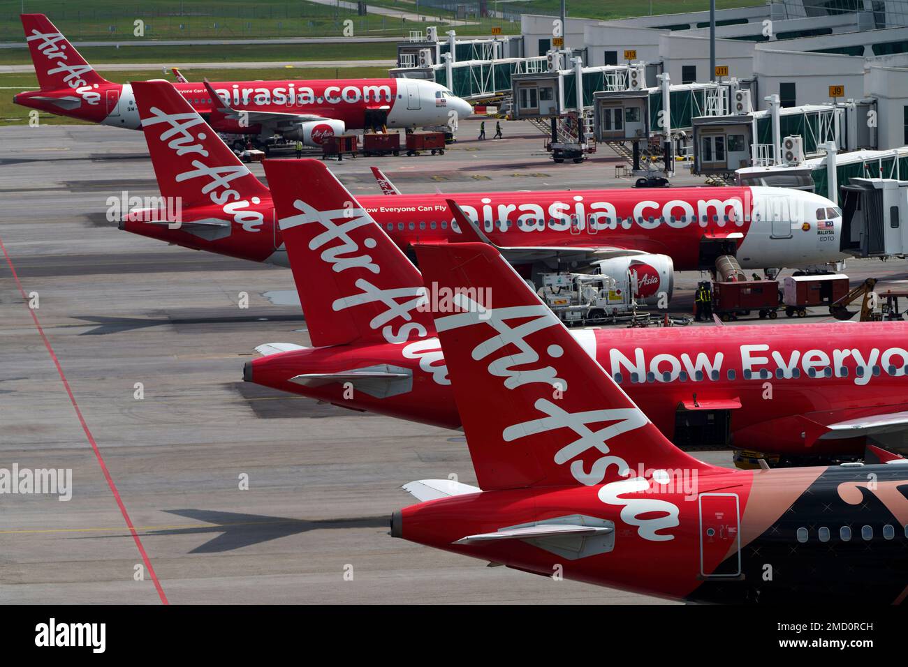 Ground staff unload from Air Asia planes Airbus A320 that parked at ...
