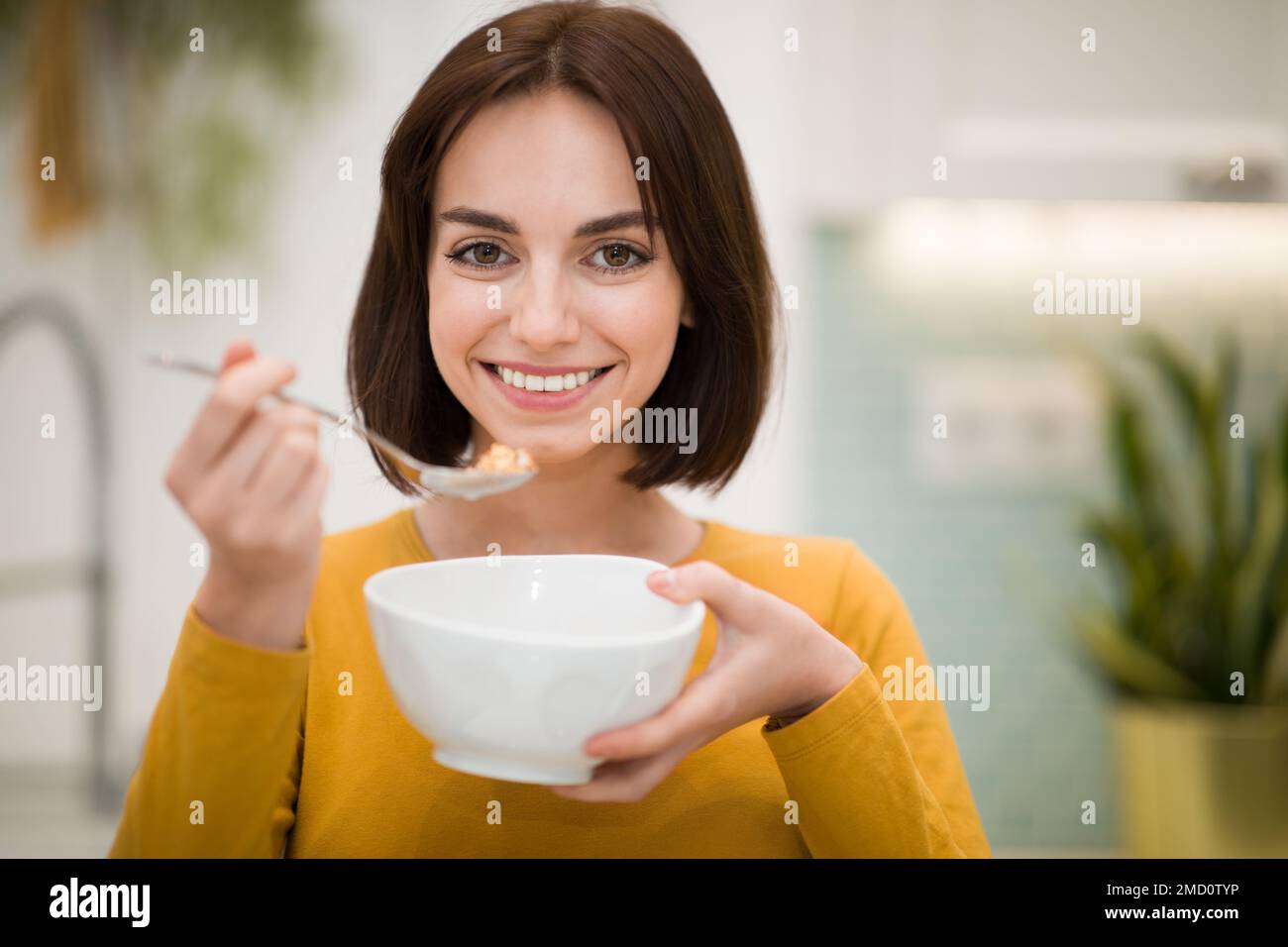 Portrait Of Pretty Smiling Fit Lady Having Oatmeal Stock Photo - Alamy