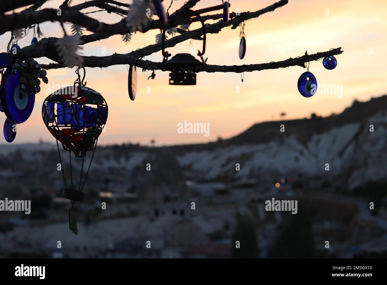 A beautiful view of a tree silhouette decorated with Turkish talismans ...