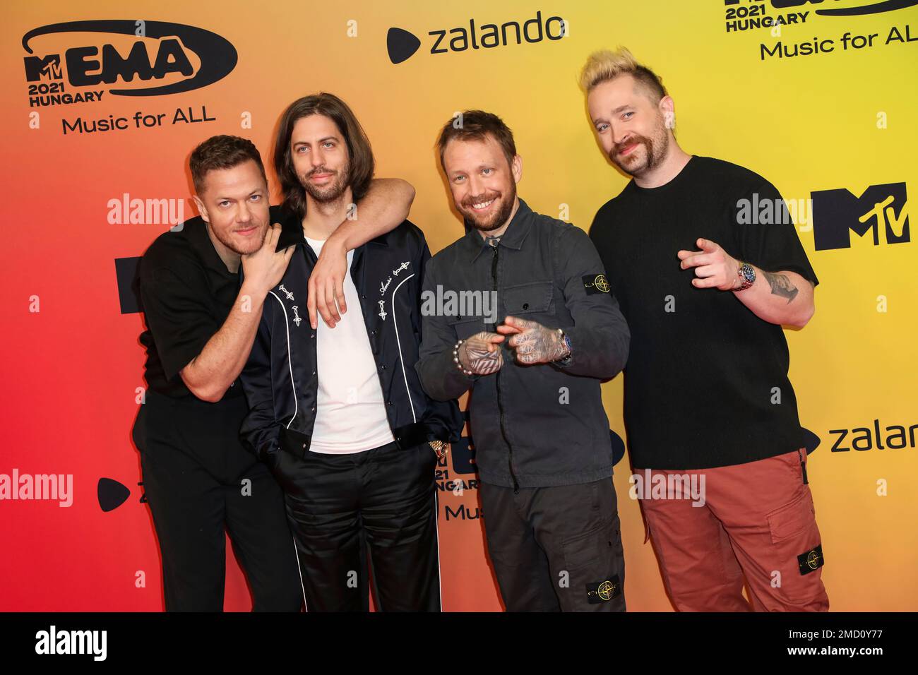 Members of music band Imagine Dragons pose for photographers upon ...