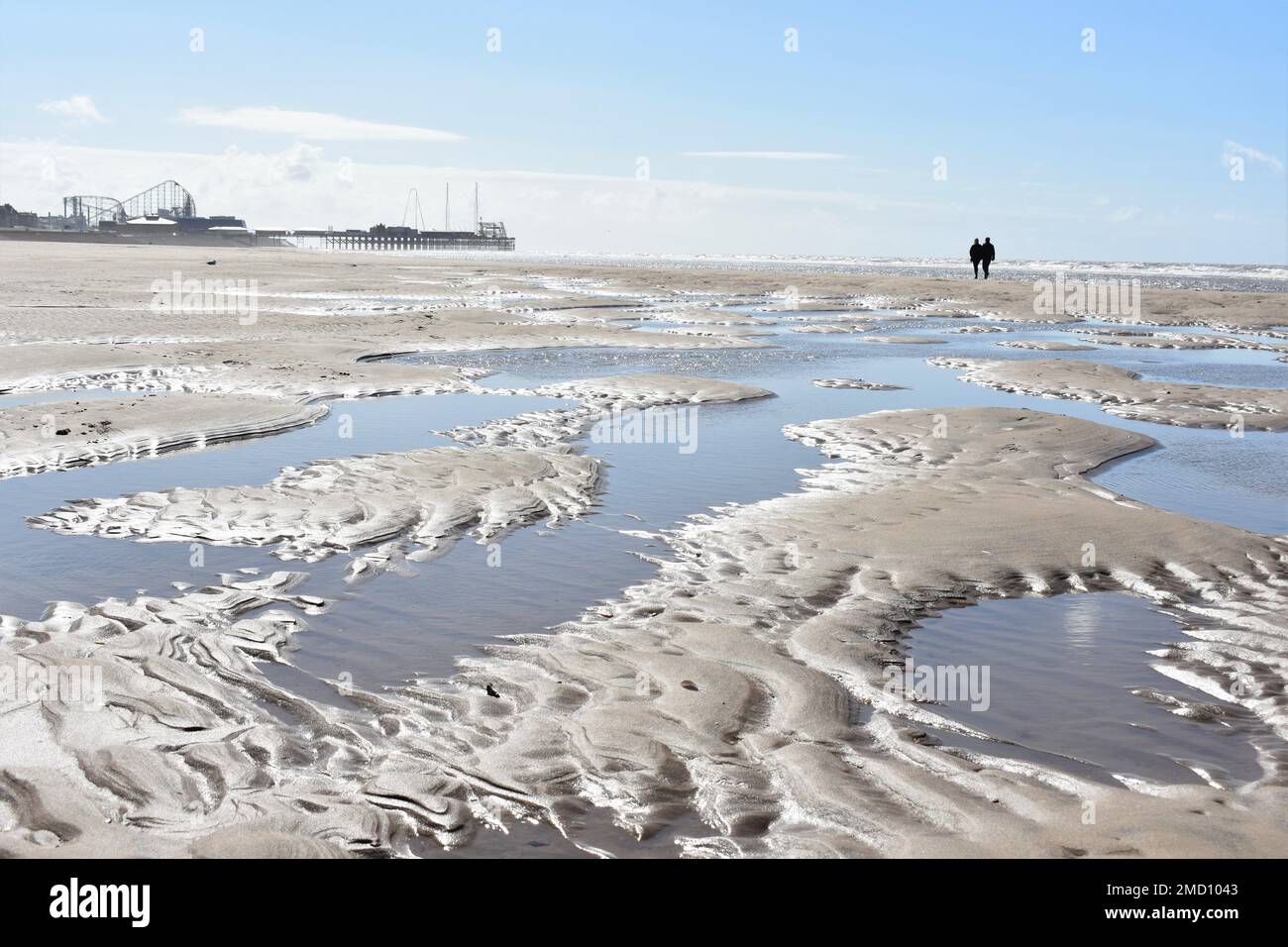 A landscape of Blackpool beach sea ocean tide out beach walk and Pier ...