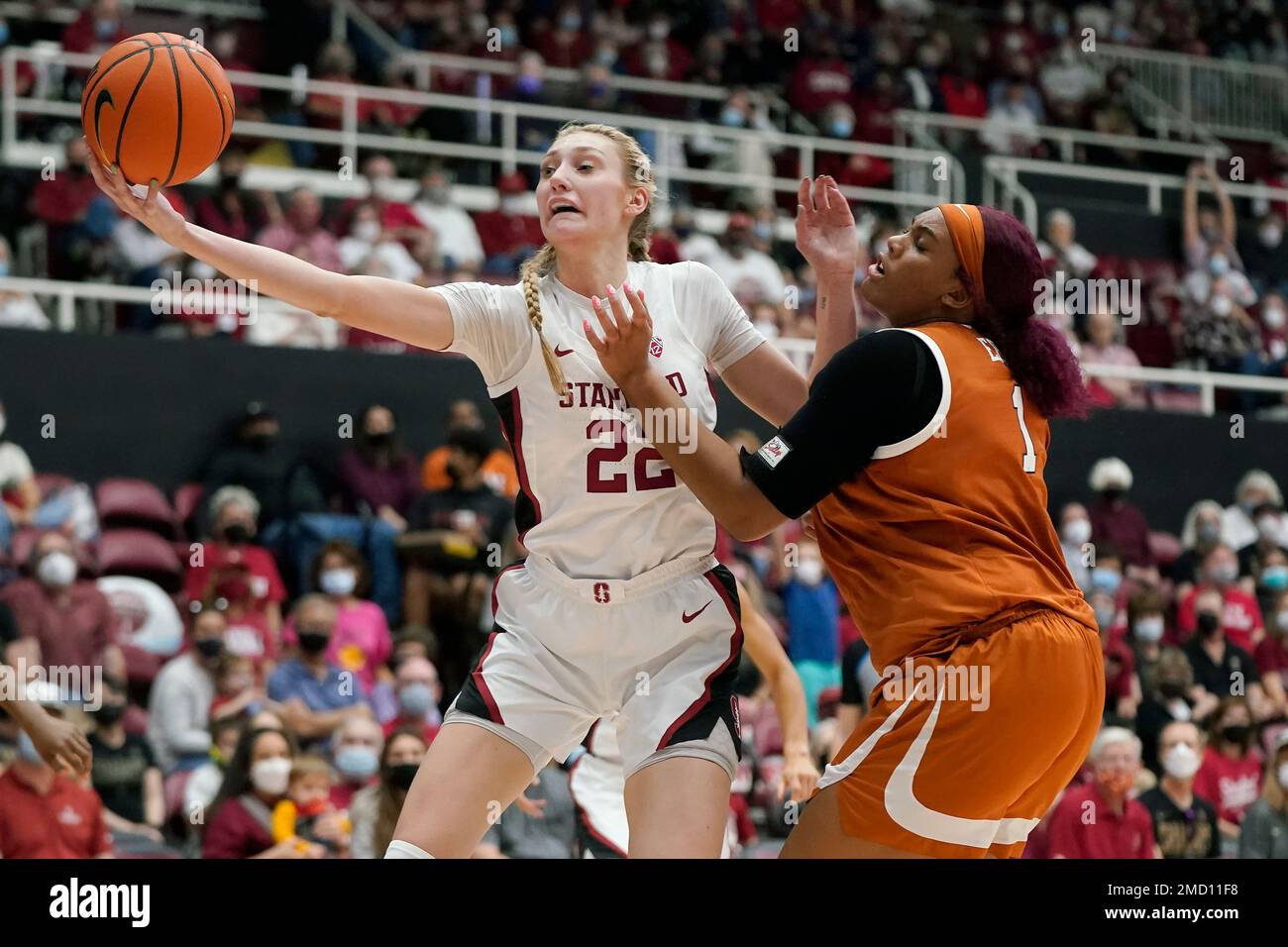 Stanford forward Cameron Brink, left, reaches for the ball next to ...