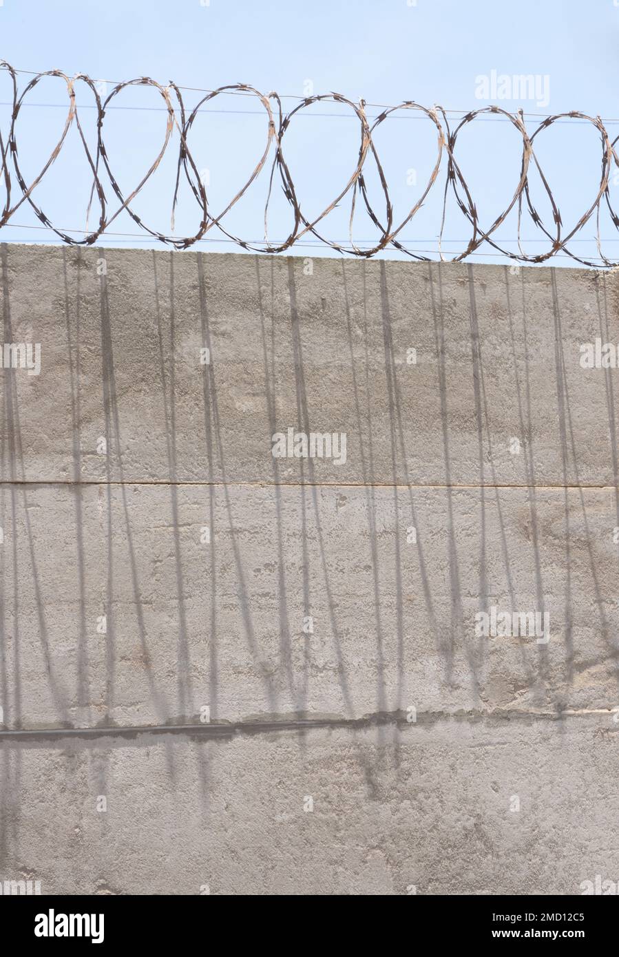 Three metre concrete walls topped by razor wire protect agricultural ...