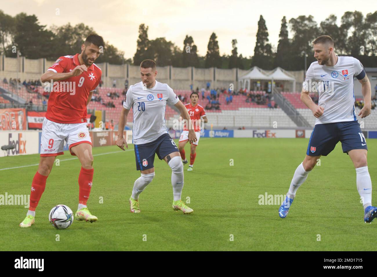 Malta's Luke Montebello, left is chased by Slovakia's Robert Mak ...