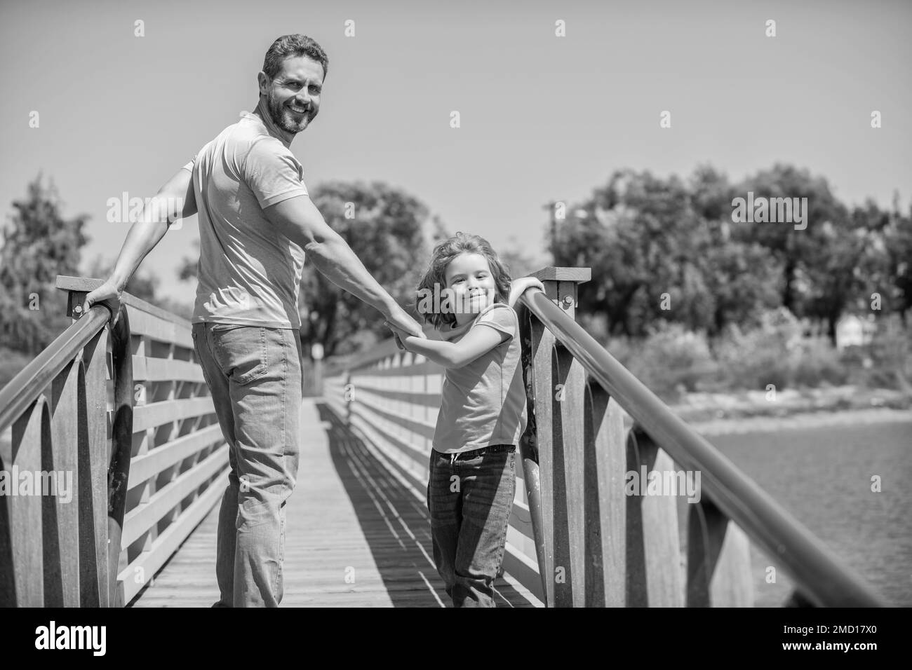 happy father having fun with his son walking outdoor, summer Stock ...