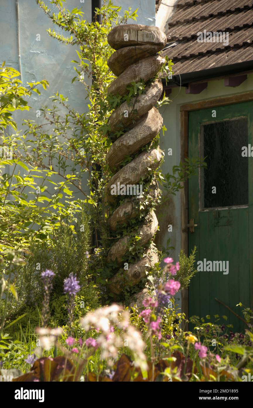 DIY totem poles in garden in Chaffcombe, Somerset Stock Photo - Alamy