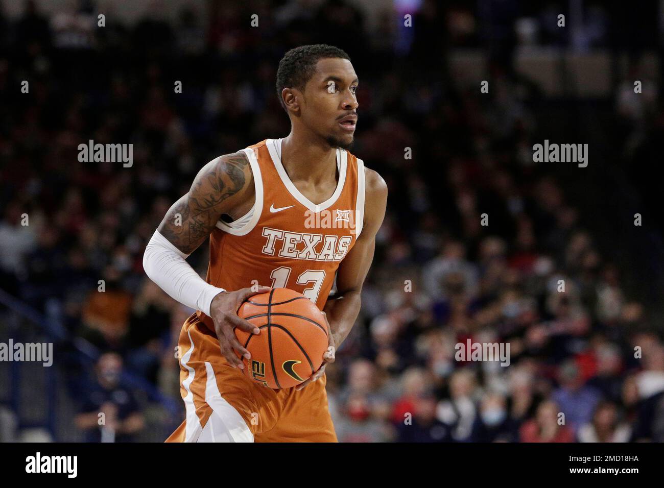 Texas guard Jase Febres controls the ball during the second half of an ...