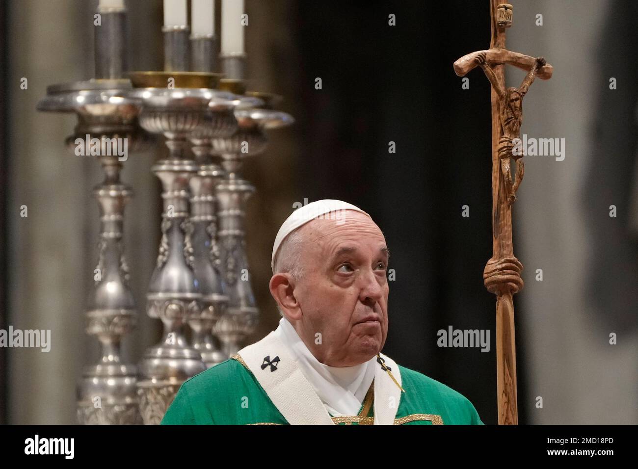 Pope Francis looks at his pastoral staff as he celebrates Mass on the ...