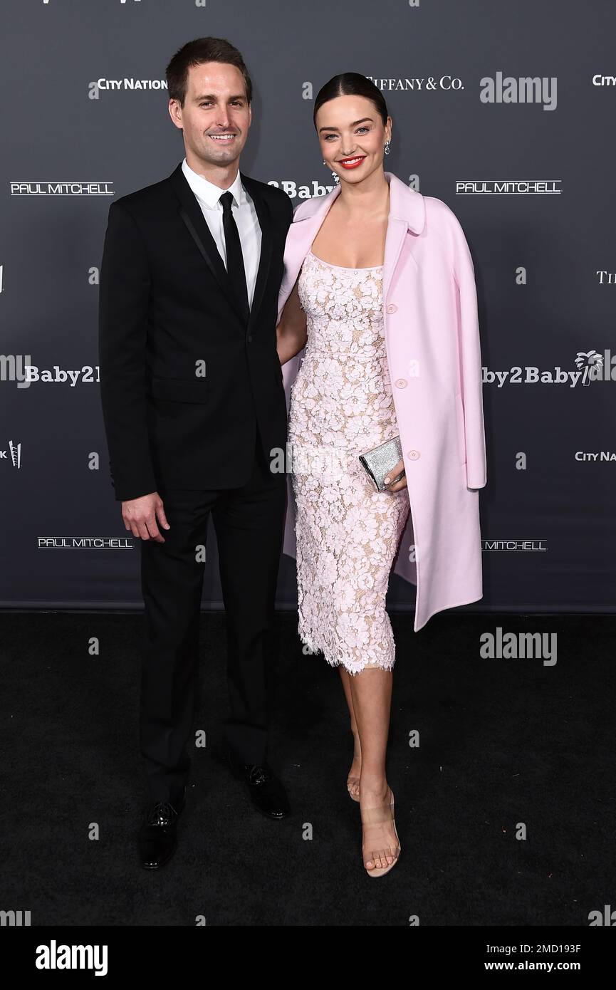 Miranda Kerr, right, and Evan Spiegel arrive at the Baby2Baby Gala at ...