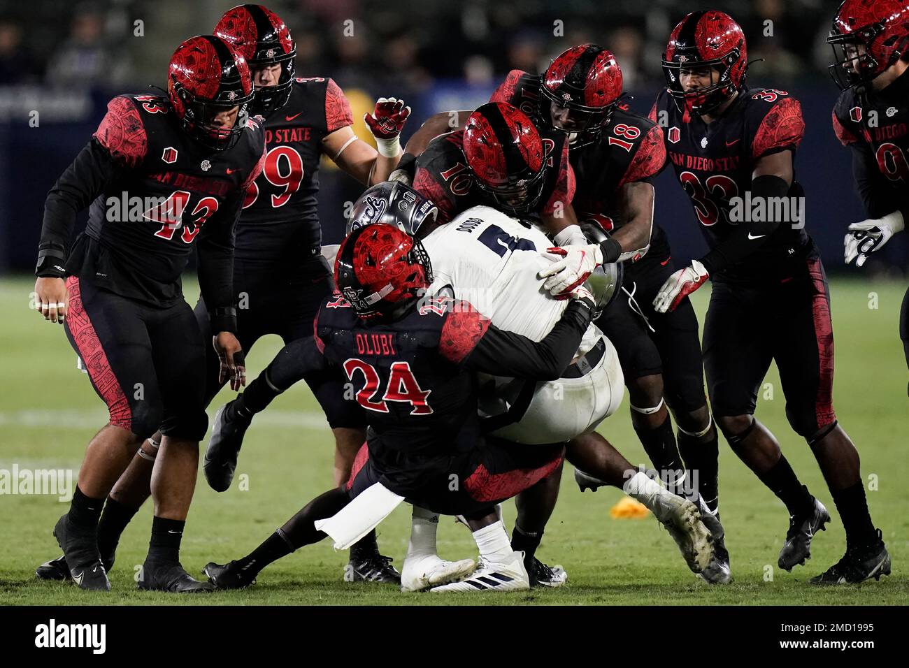 Nevada wide receiver Romeo Doubs (7) is pulled down by San Diego State ...