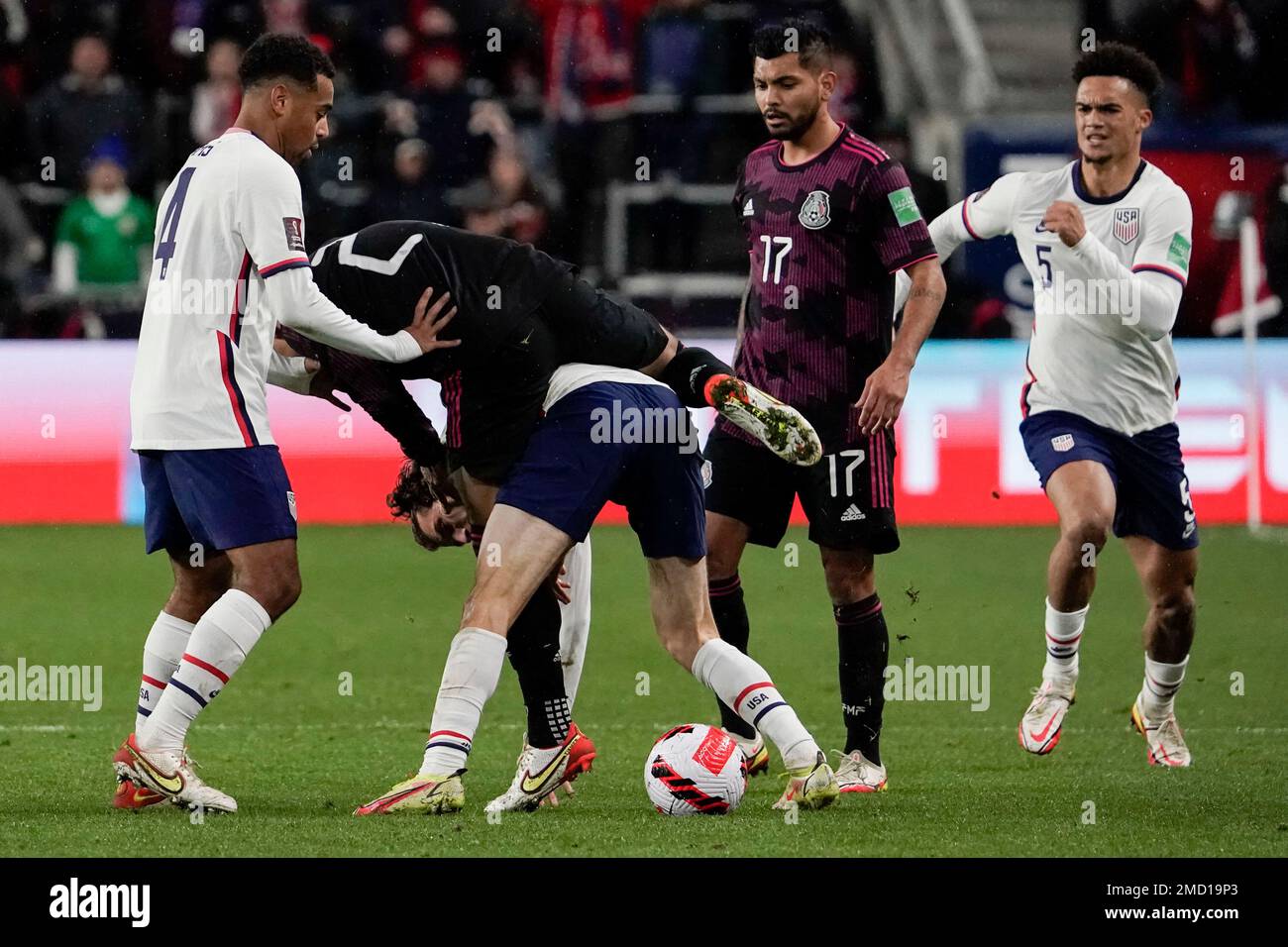 Mexico's Luis Rodriguez (21) fouls United States' Brenden Aaronson (11 ...