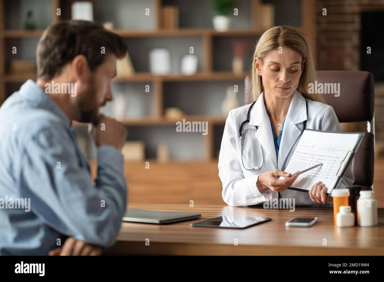 Male doctor checking medicine prescription hi-res stock photography and ...