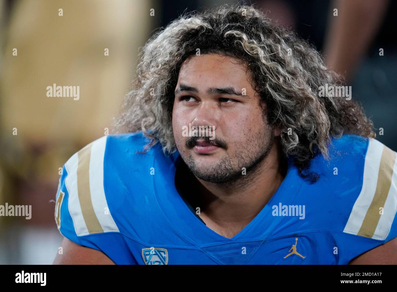 UCLA offensive lineman Sean Rhyan sits on the bench during the first ...