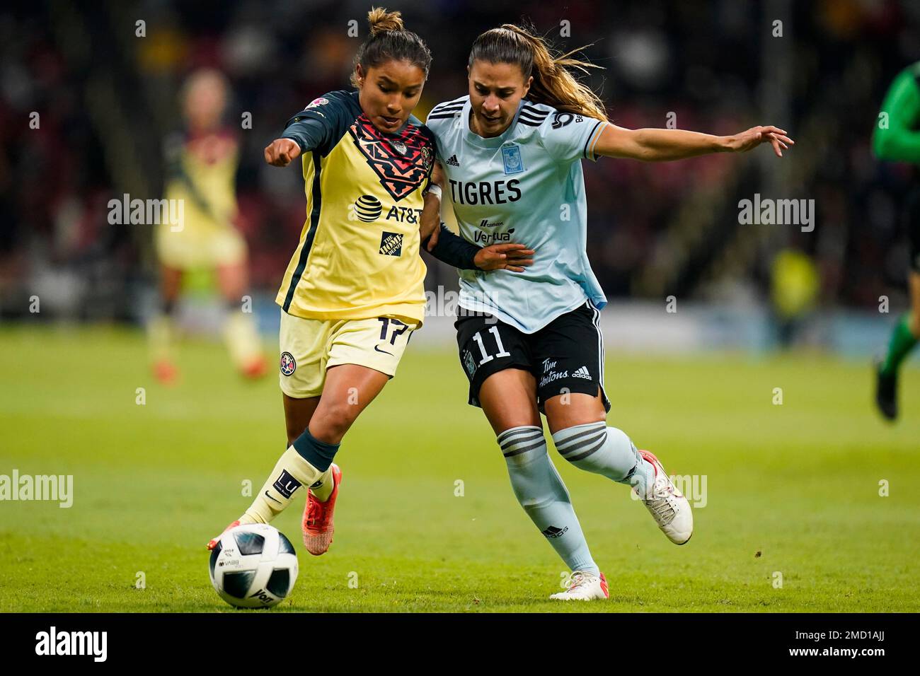 America's Maria Mauleon, left, and Tigres' Lydia Rangel fight for the ...