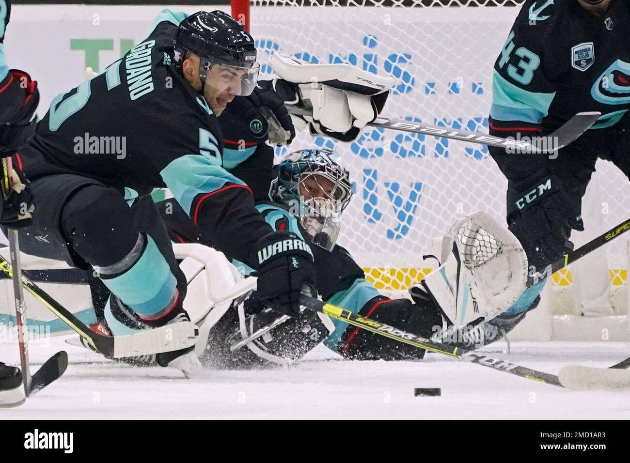 Seattle Kraken defenseman Mark Giordano, left, and goaltender Philipp ...