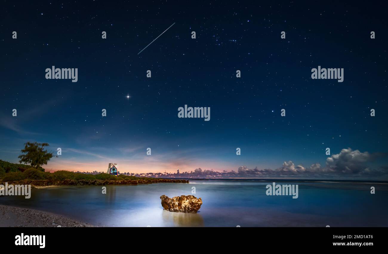 A beautiful view of ocean water with starry sky in the background Stock ...