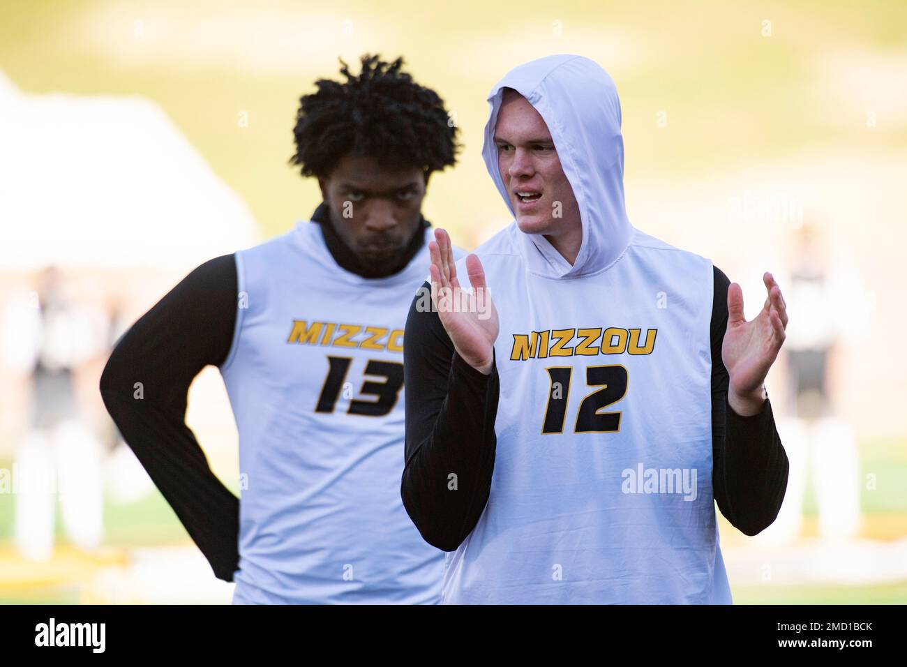 Missouri quarterback Brady Cook, right, and JJ Hester, left, warm up ...