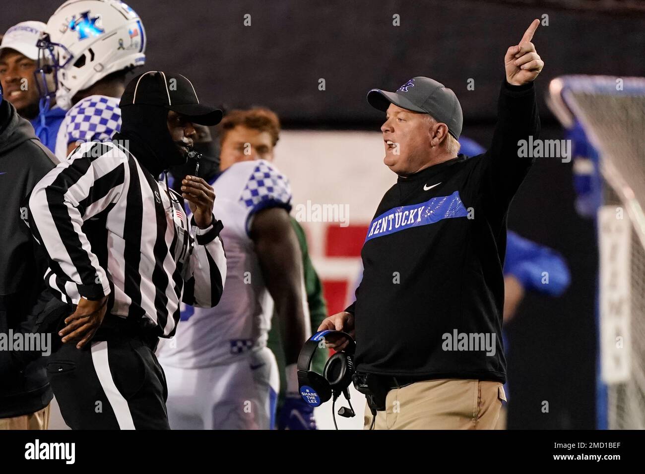 Kentucky head coach Mark Stoops talks with an official in the first ...