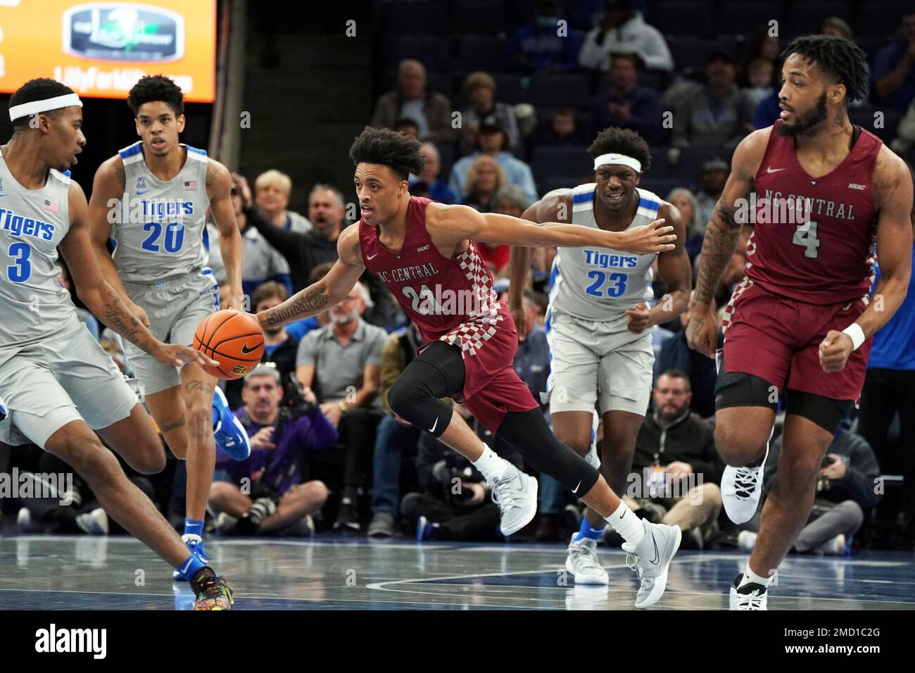 North Carolina Central's Eric Boone (21) drives the ball down the court ...