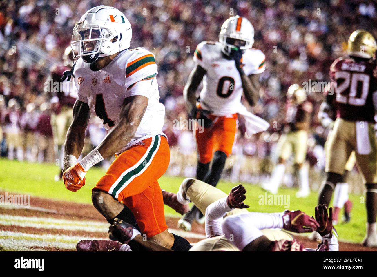 Miami running back Jaylan Knighton (4) reacts to scoring a touchdown ...