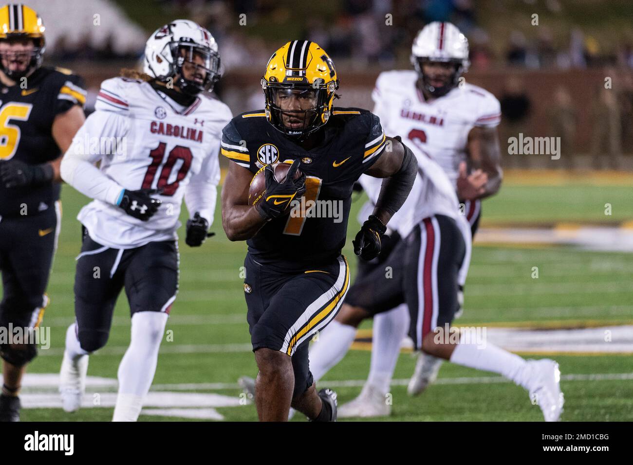 Missouri running back Tyler Badie, center, scores a touchdown in front ...