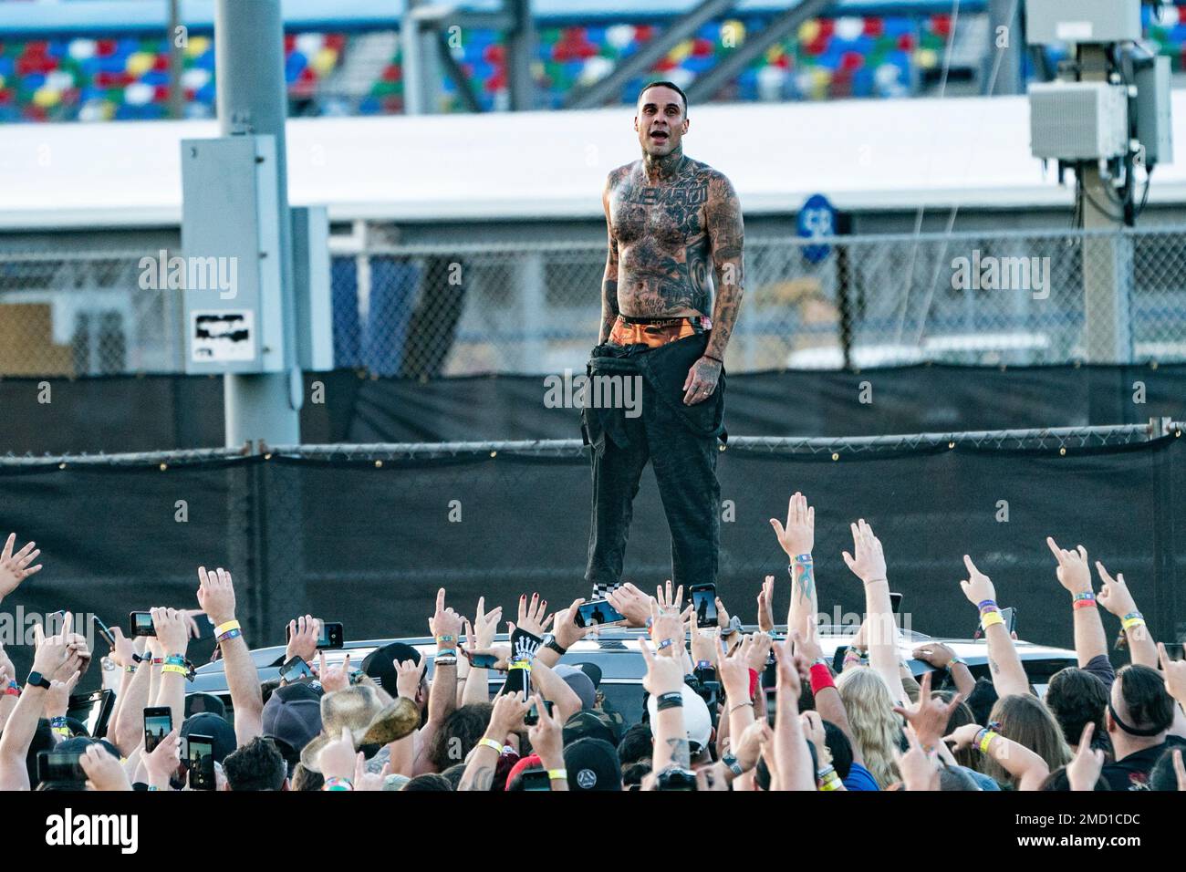 Jason Aalon Butler of Fever 333 performs on a car at Welcome to ...