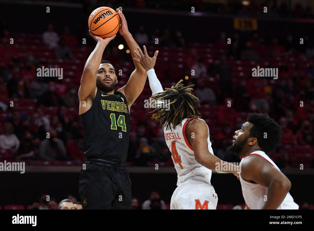Vermont forward Isaiah Powell (14) shoots the ball over Maryland guard ...
