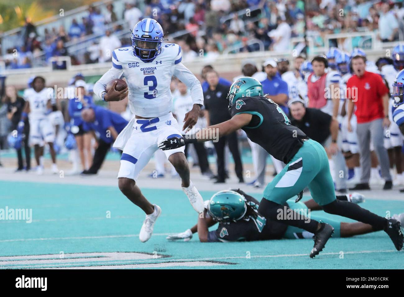 Georgia State quarterback Darren Grainger (3) is tackled by Coastal ...