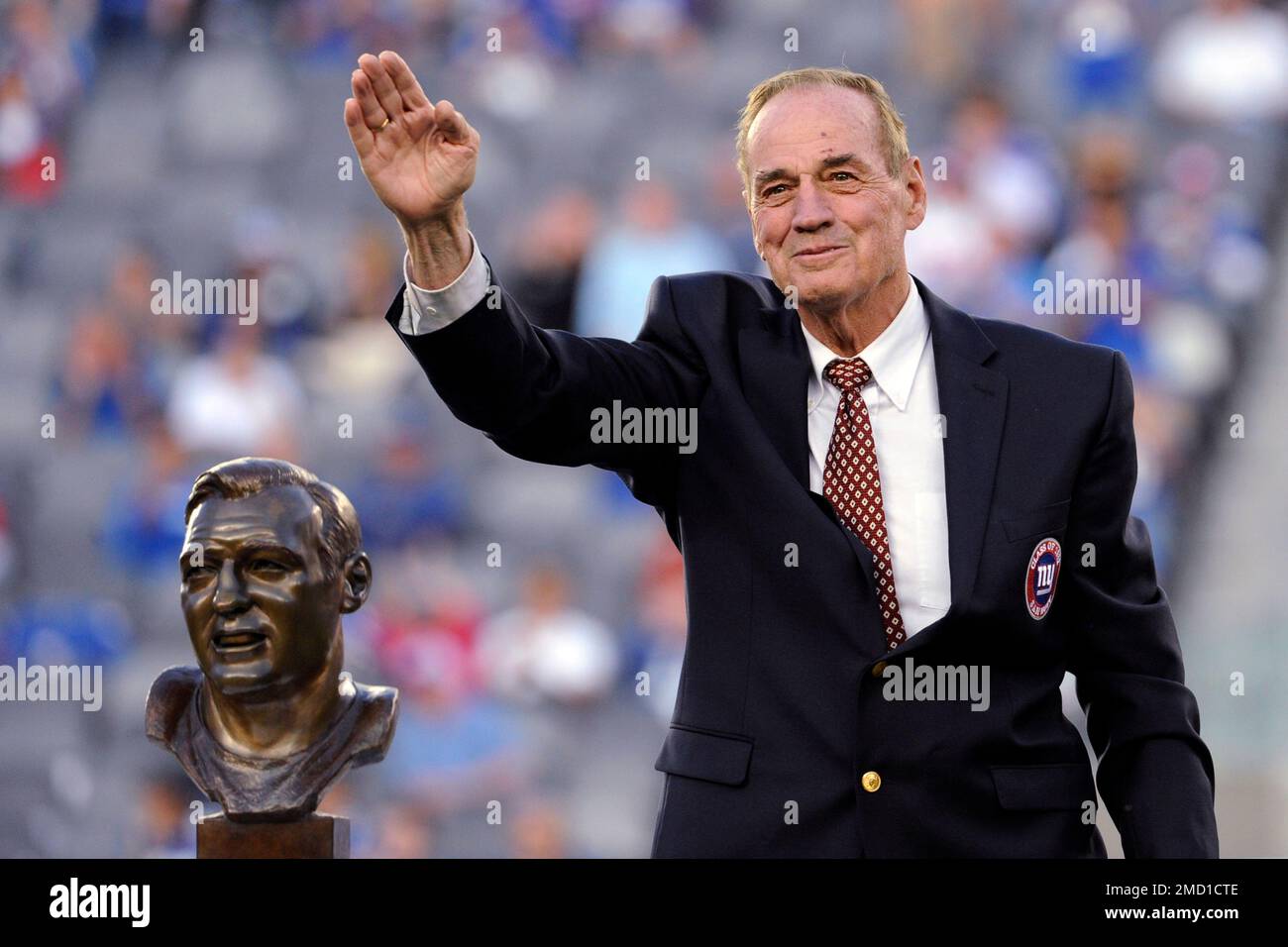 FILE - Former New York Giants linebacker Sam Huff waves to the fans as ...