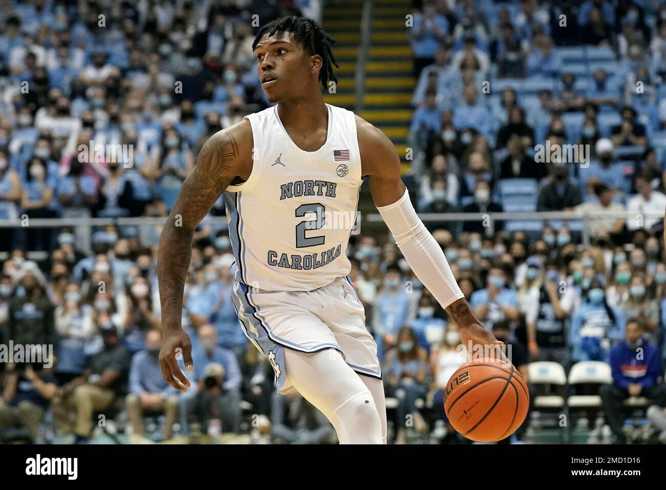 North Carolina guard Caleb Love (2) dribbles during the first half of ...