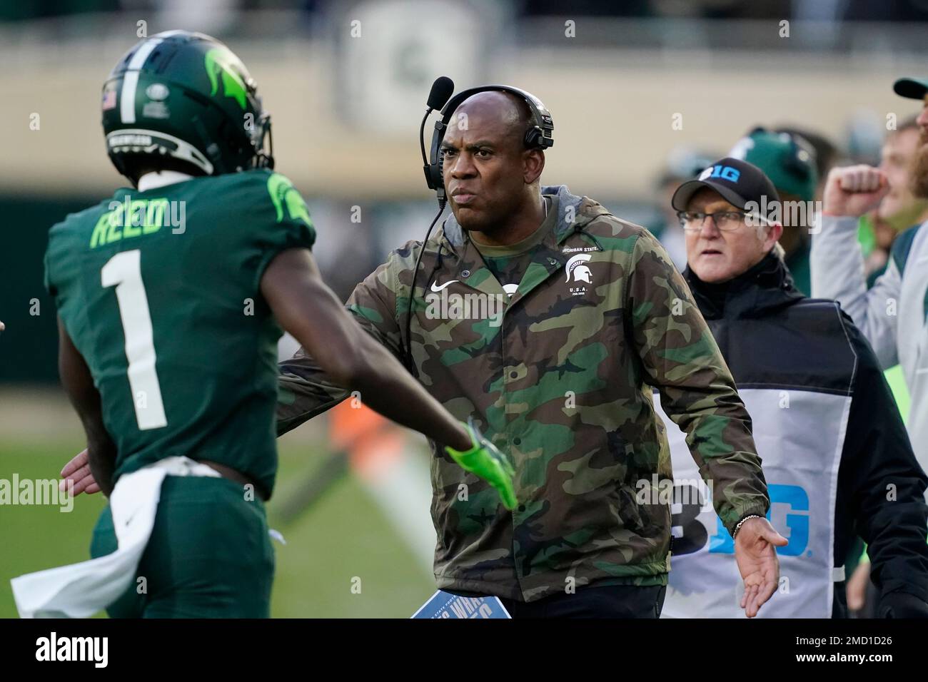 Michigan State head coach Mel Tucker greets wide receiver Jayden Reed ...