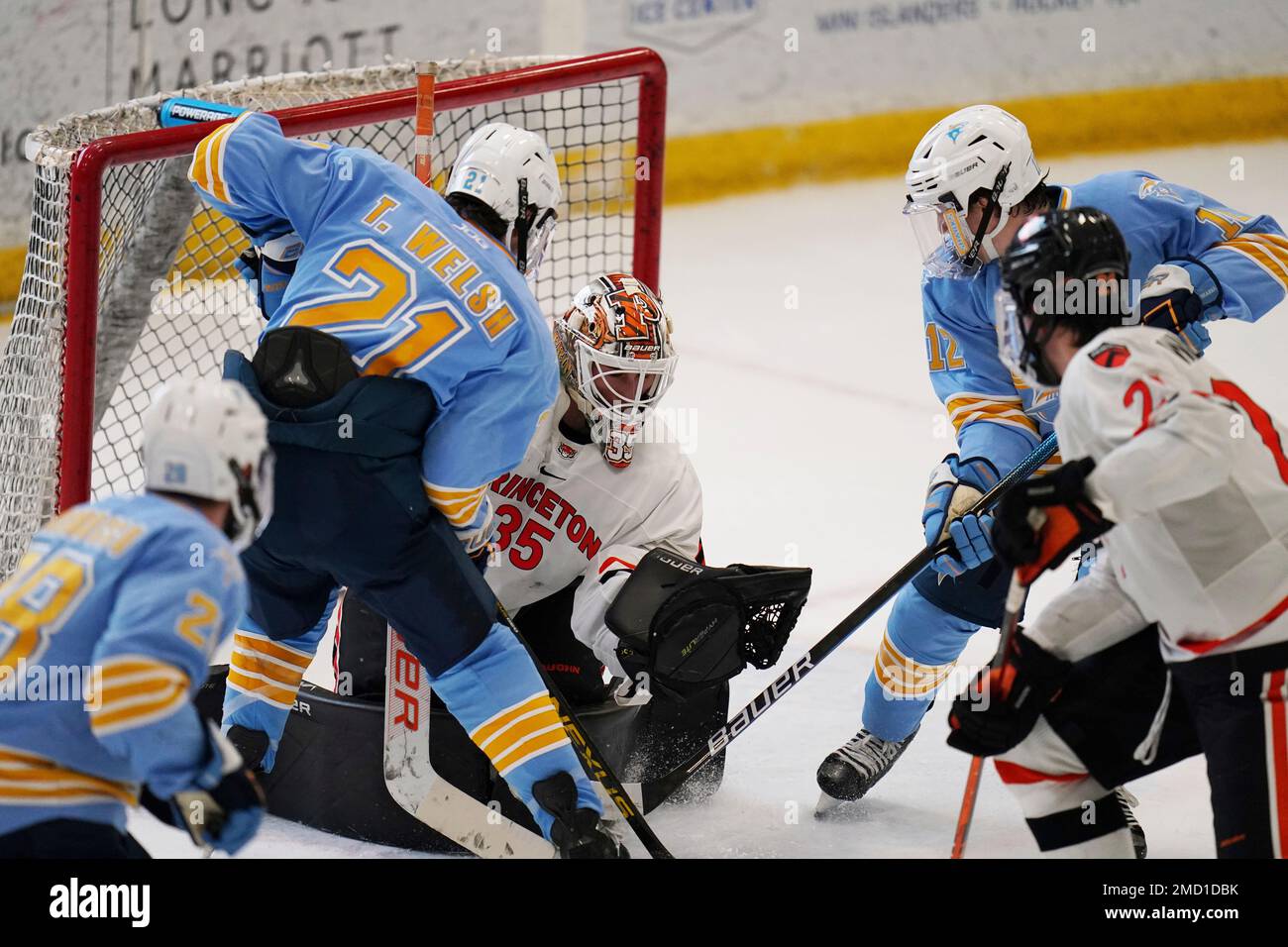 Princeton goaltender Aidan Porter (35) defends at the net during an NCAA hockey game against LIU ...