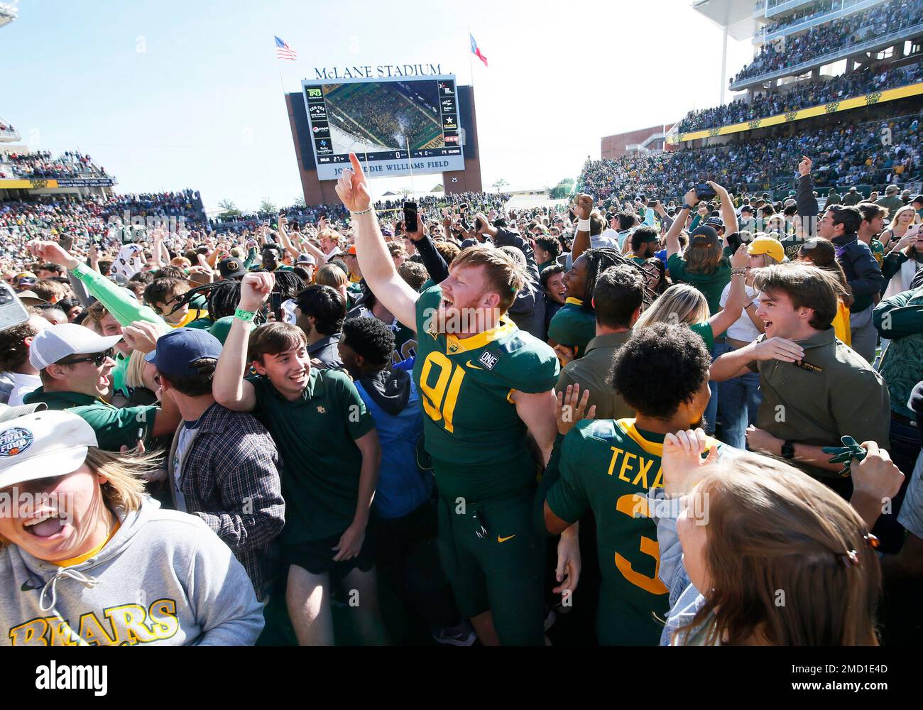 Baylor defensive lineman Rob Saulin (91) celebrates with fans after a ...