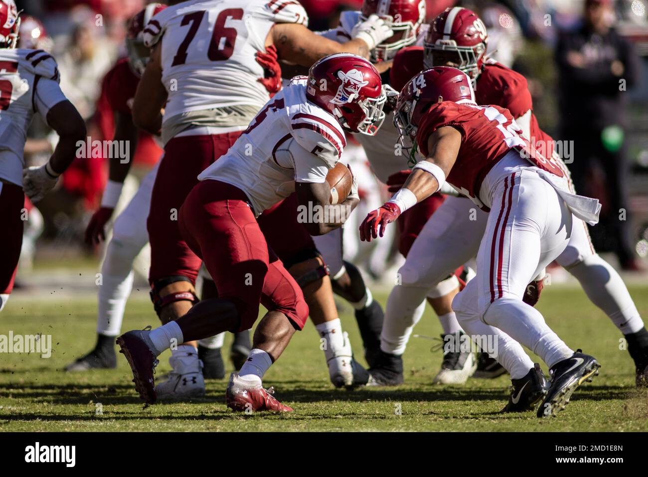 New Mexico State running back O'Maury Samuels (5) looks for an avenue ...