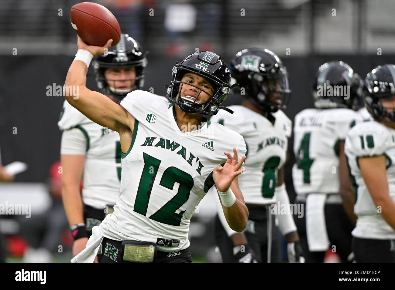 Hawaii quarterback Chevan Cordeiro (12) warms up before an NCAA college ...
