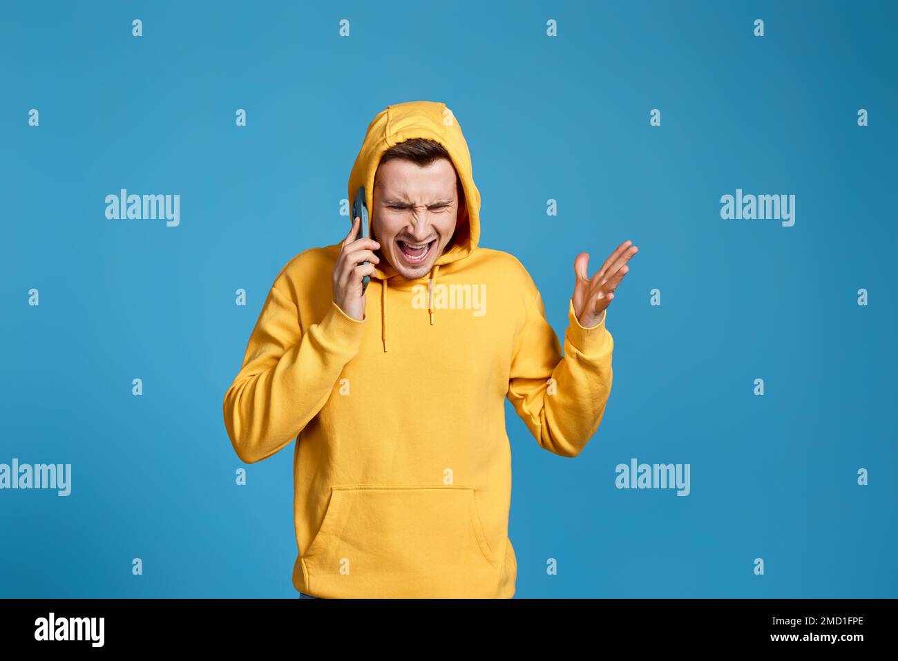 Angry man in yellow hi-res stock photography and images - Alamy