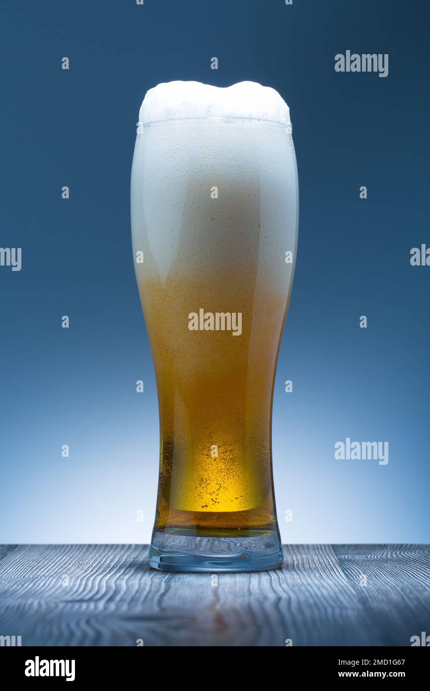 Beer. Cold Craft light Beer in a glass. Close up of a pint of beer ...