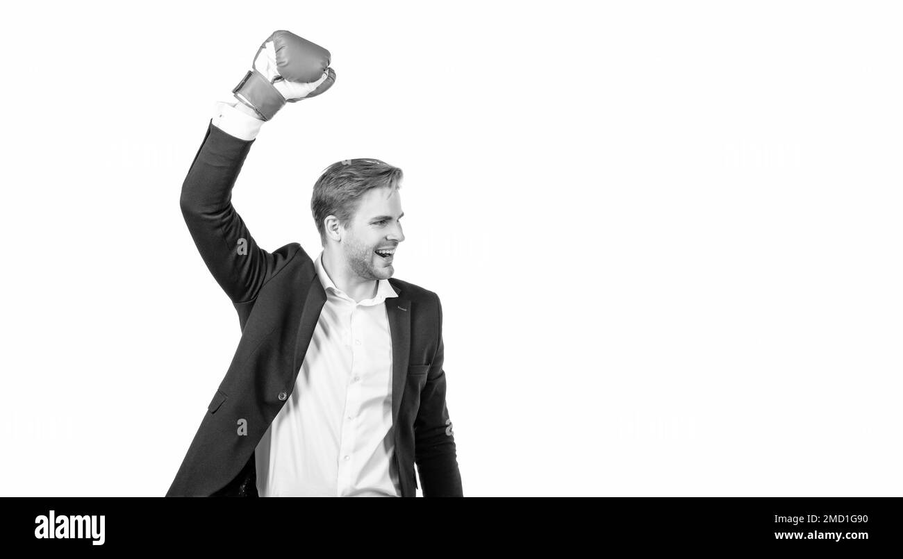 Success is born in fight. Happy businessman raise hand in boxing glove ...