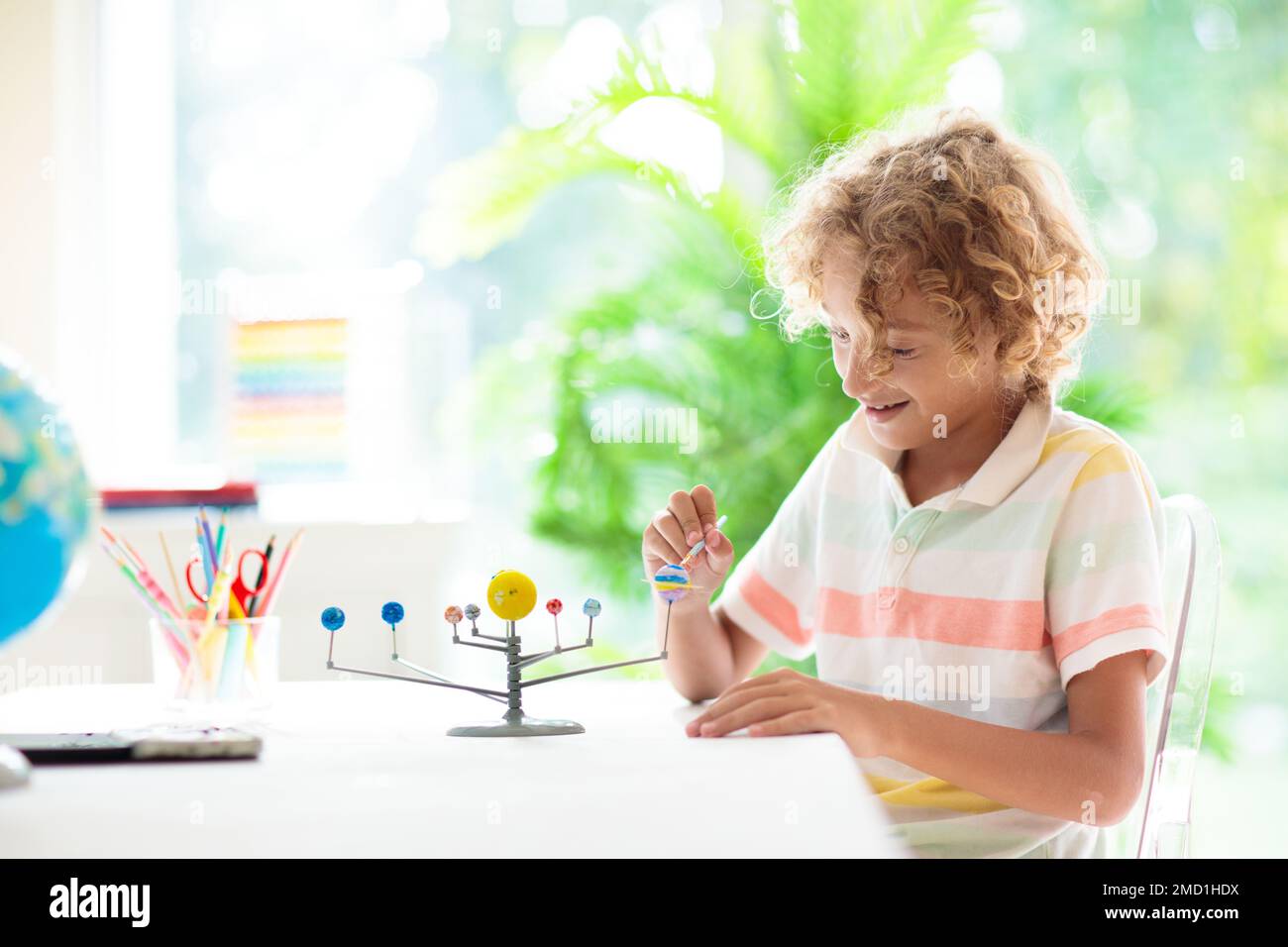 Child with solar system model. Kids planetarium. Little boy coloring ... Child with solar system model. Kids planetarium. Little boy coloring ...