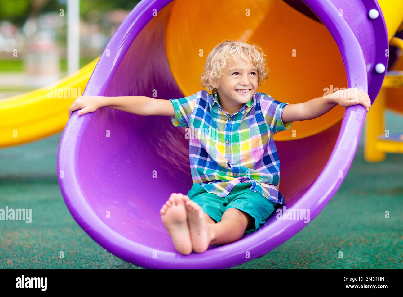 Child playing on outdoor playground. Kids play on school or ...