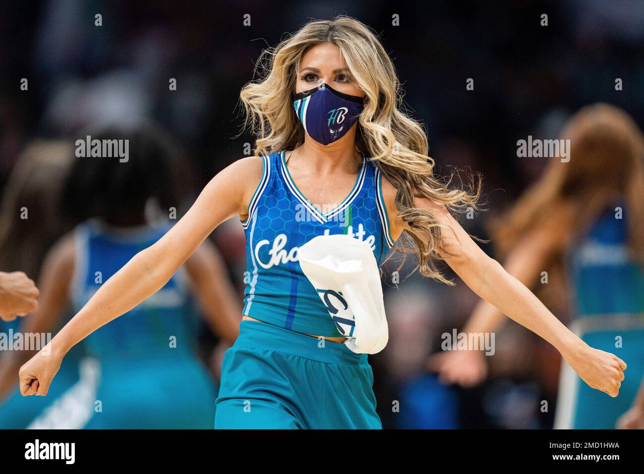 A Charlotte Hornets dancer and cheerleader performs during an NBA ...