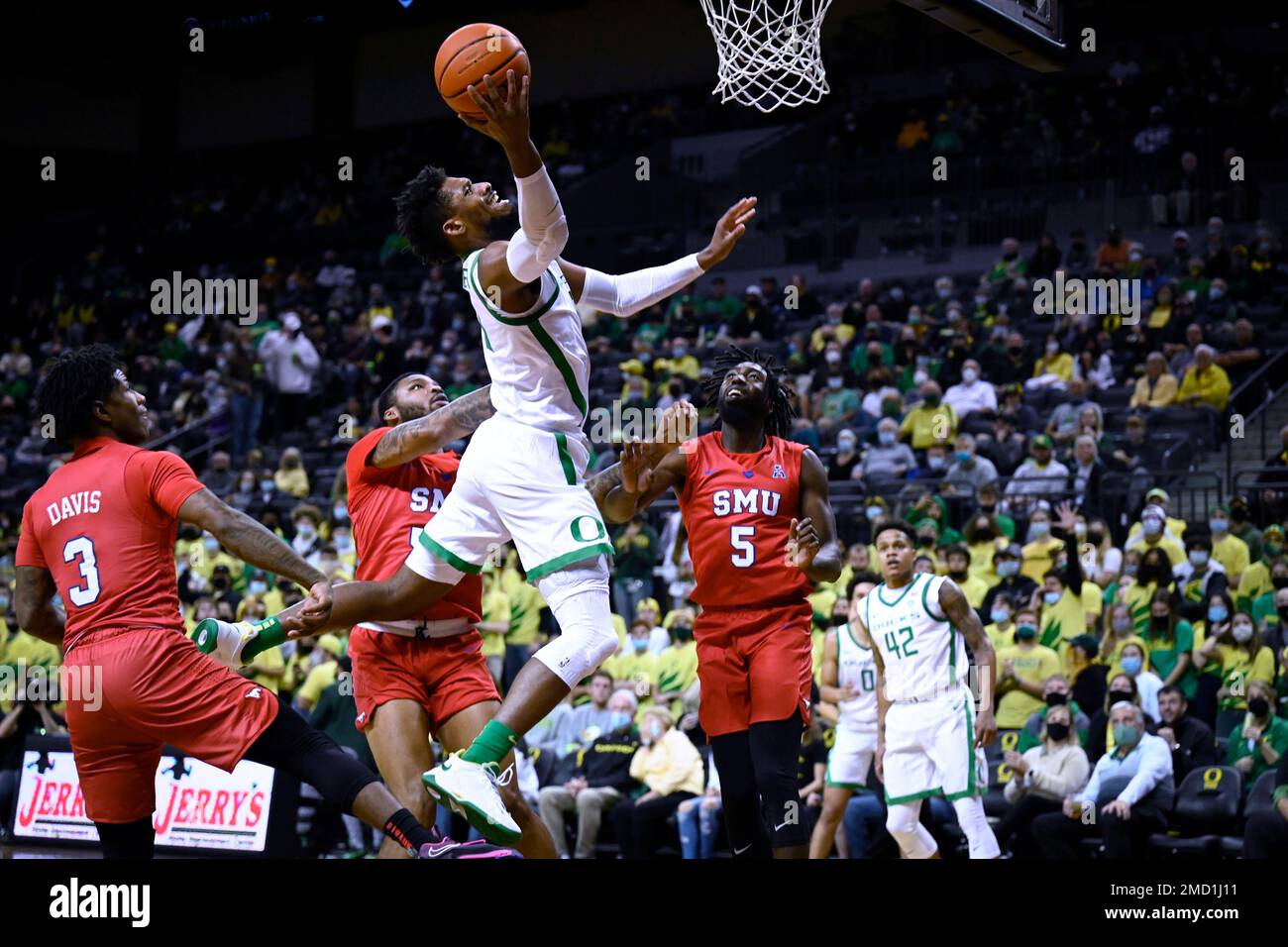 Oregon forward Quincy Guerrier (13) is fouled by SMU forward Marcus ...