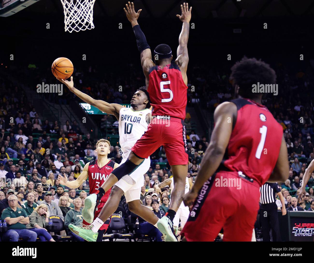 Baylor guard Adam Flagler (10) attempts a shot past Incarnate Word ...